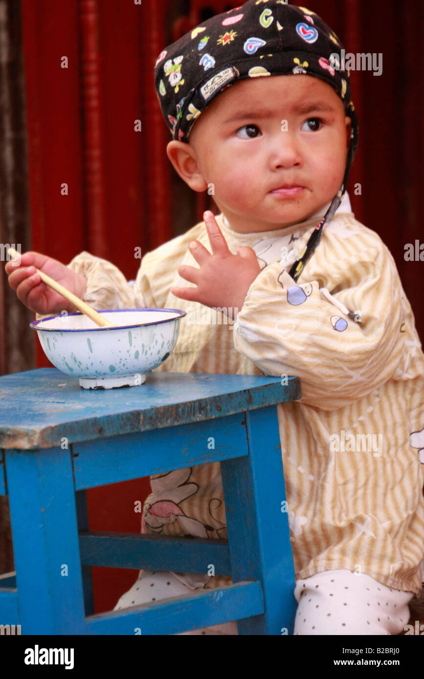 Chinese child at a tribal market near Yuanyang, Yunnan, China Stock ...