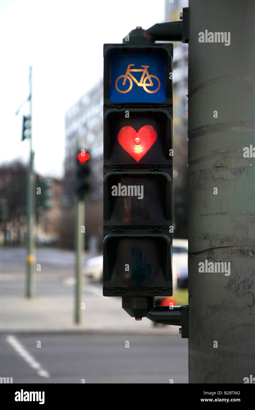 Bicycle traffic light altered with Graffiti to a heart shape, Berlin ...