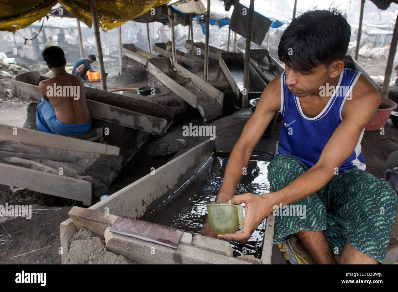 Many slum inhabitants live from recycling old industrial waste. Here ...
