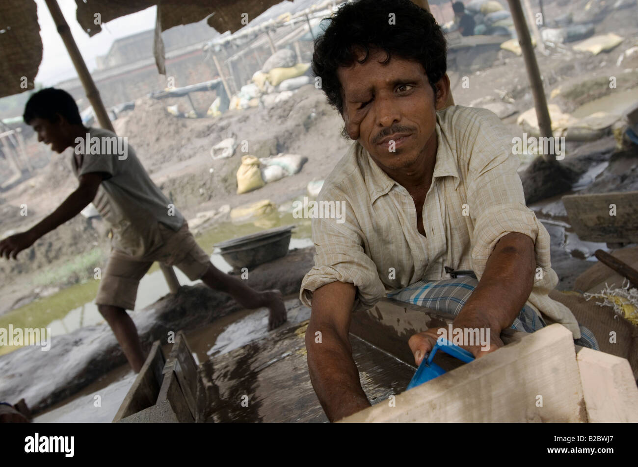 Many slum inhabitants live from recycling old industrial waste. Here ...