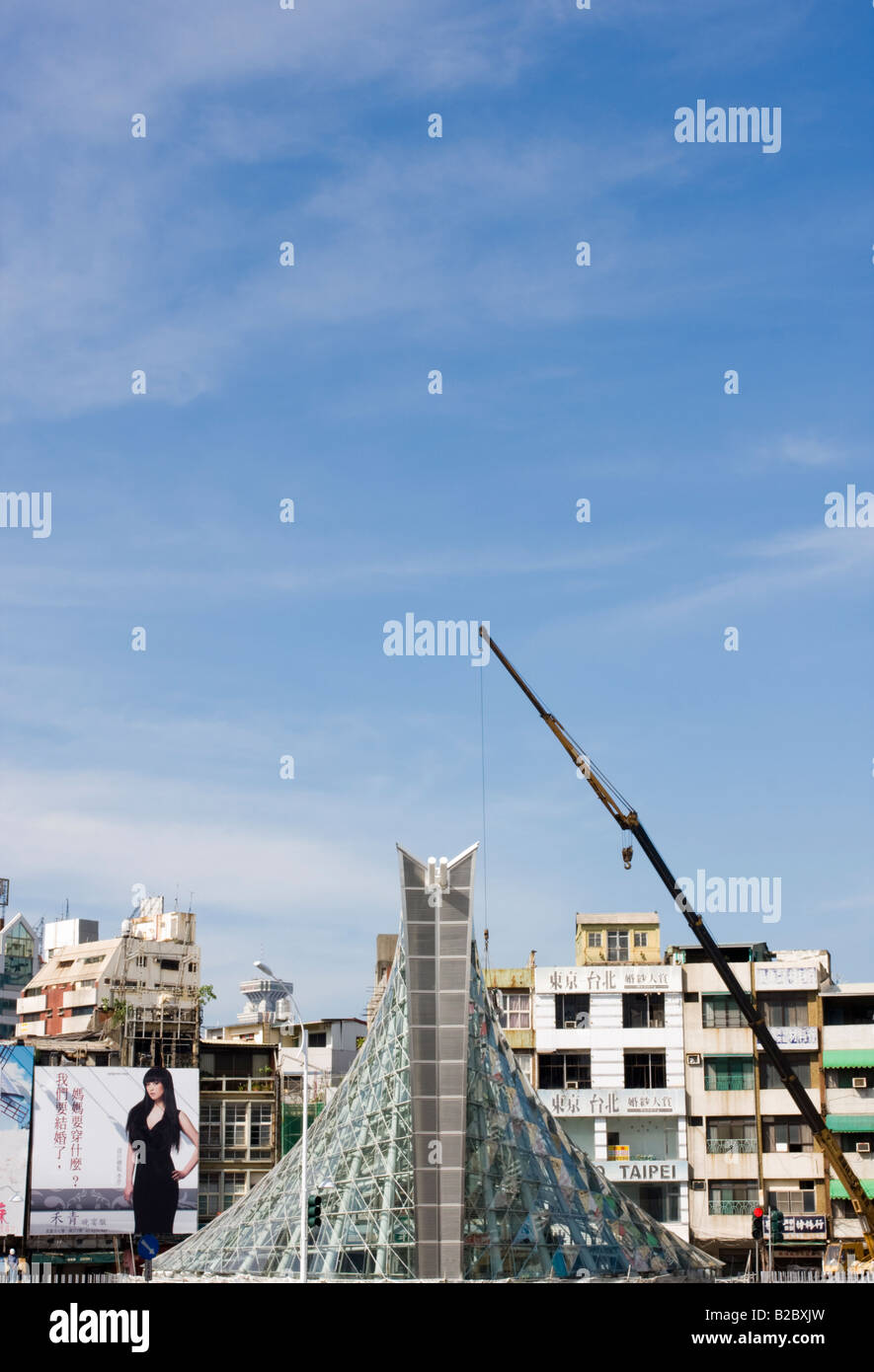 Construction crane and glass entrance exit spire Formosa Boulevard Mass ...
