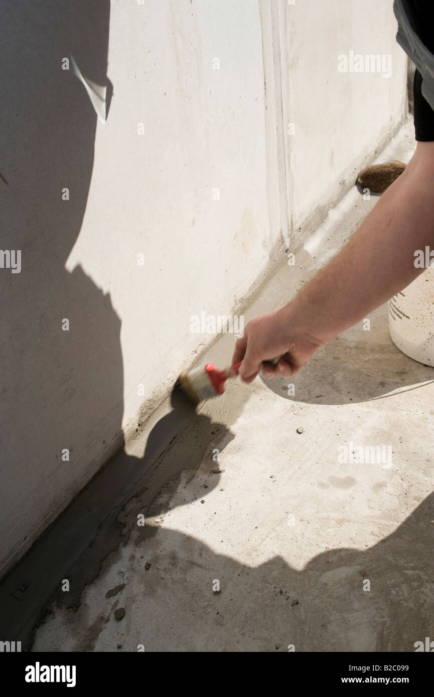 Trowel application to the foundation Stock Photo - Alamy