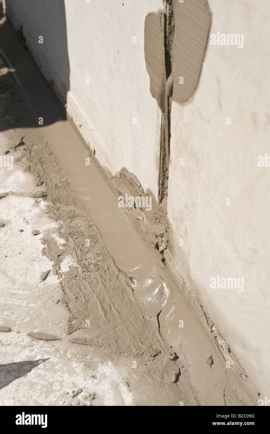 Trowel application to the foundation Stock Photo - Alamy