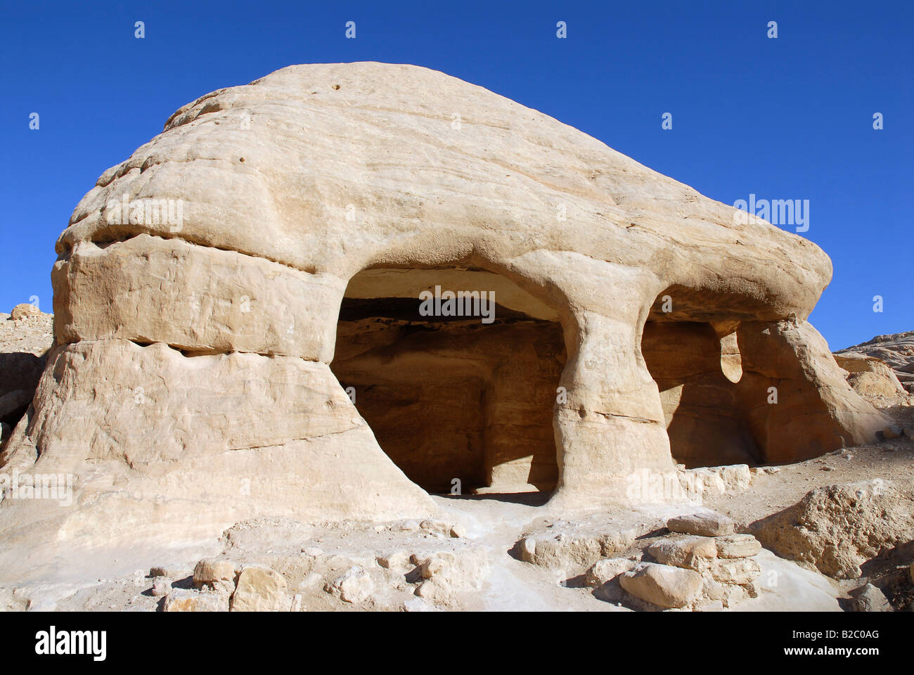 Caves along the Bab Al-Siq Valley leading up to the Siq or gorge, the ...
