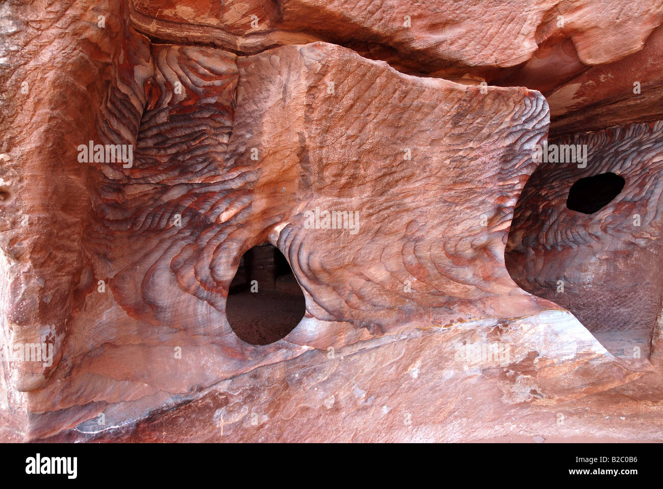 Multicoloured grain in rock formations conceal stone tombs, Petra ...