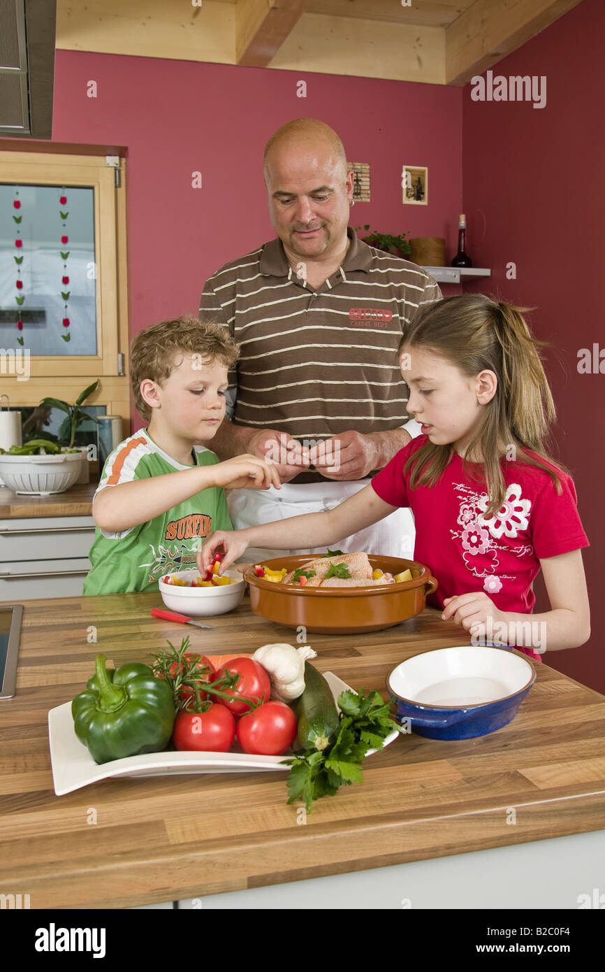 Father helps daughter light hi-res stock photography and images - Alamy