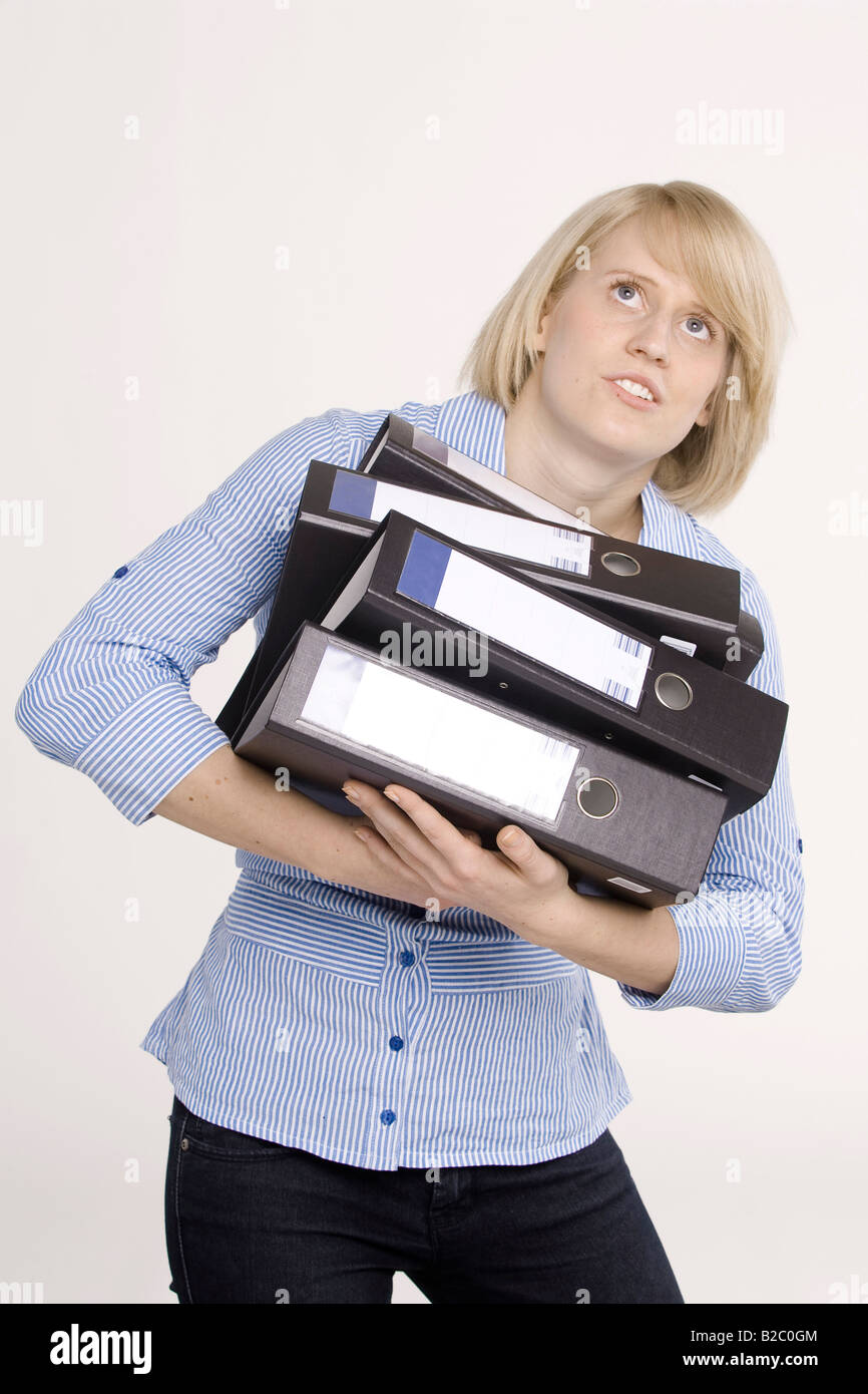Young woman carrying files Stock Photo - Alamy