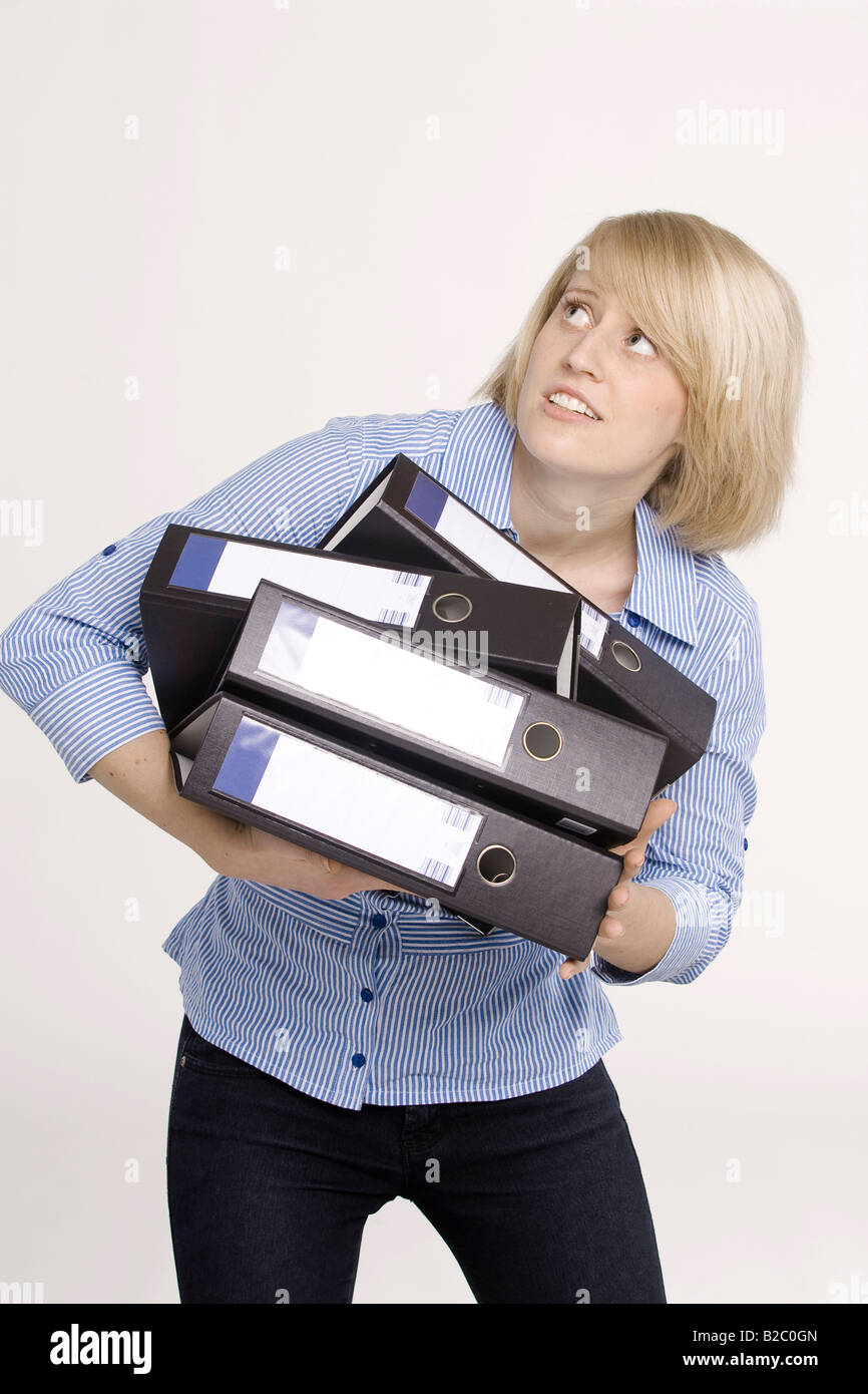 Young woman carrying files Stock Photo - Alamy