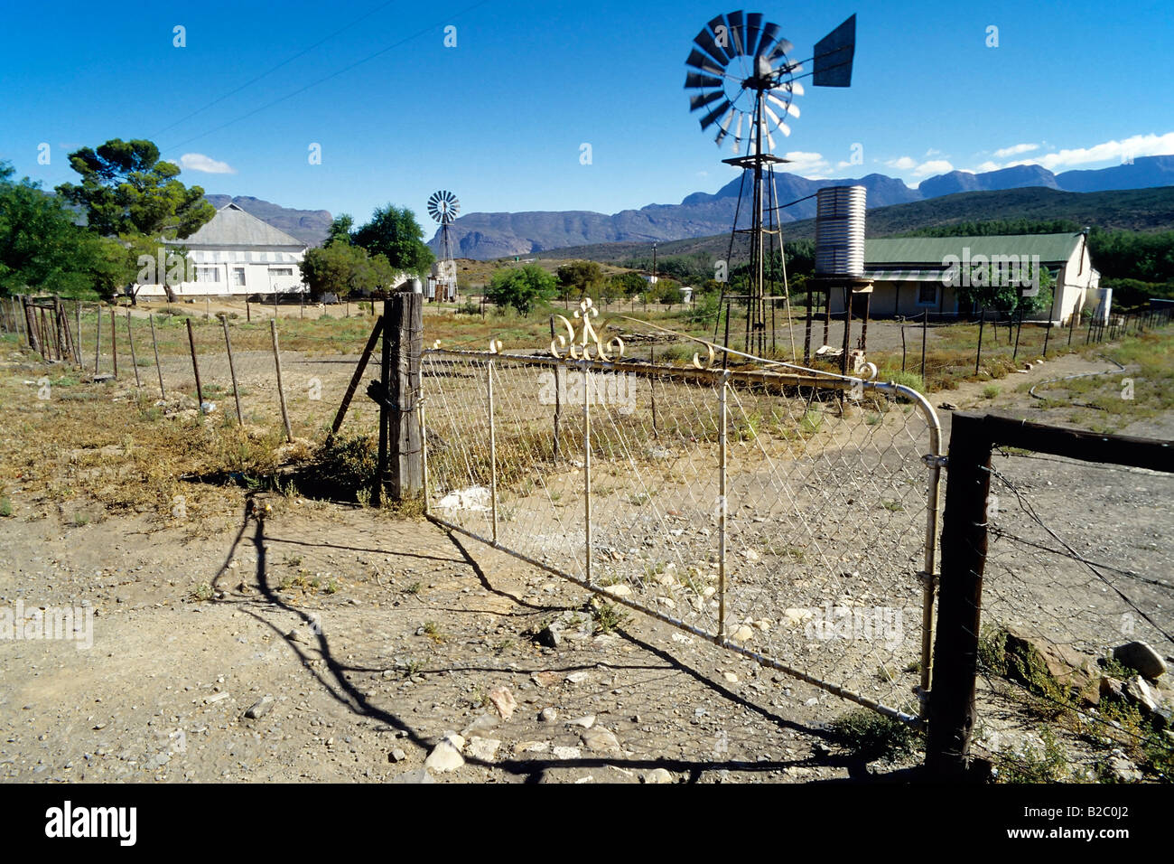 Isolated farm with a windmill, wind pump, Great Karoo, semi-desert ...