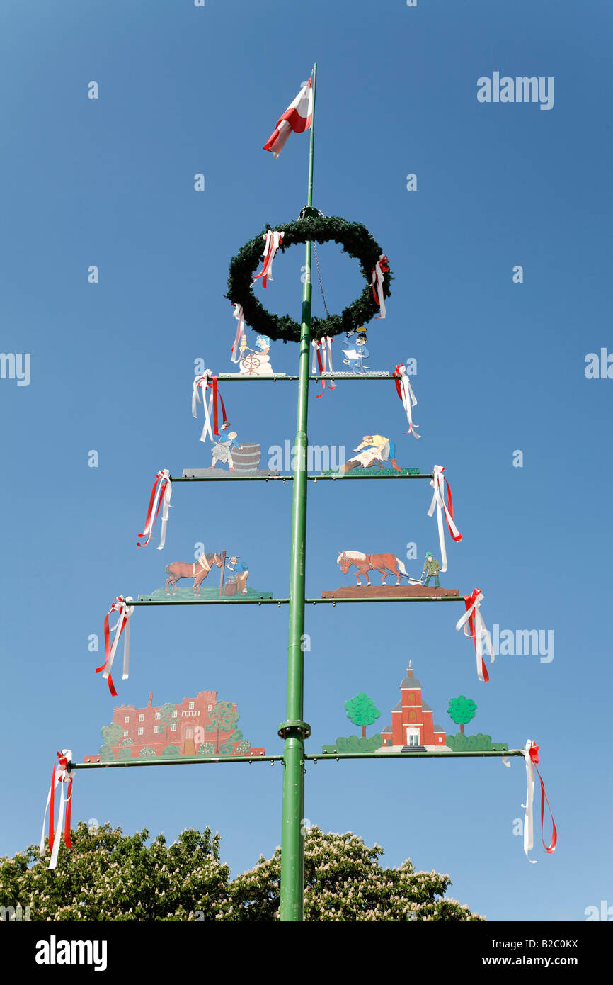 May pole decorated with a wreath and symbols, Krefeld-Linn, Lower ...