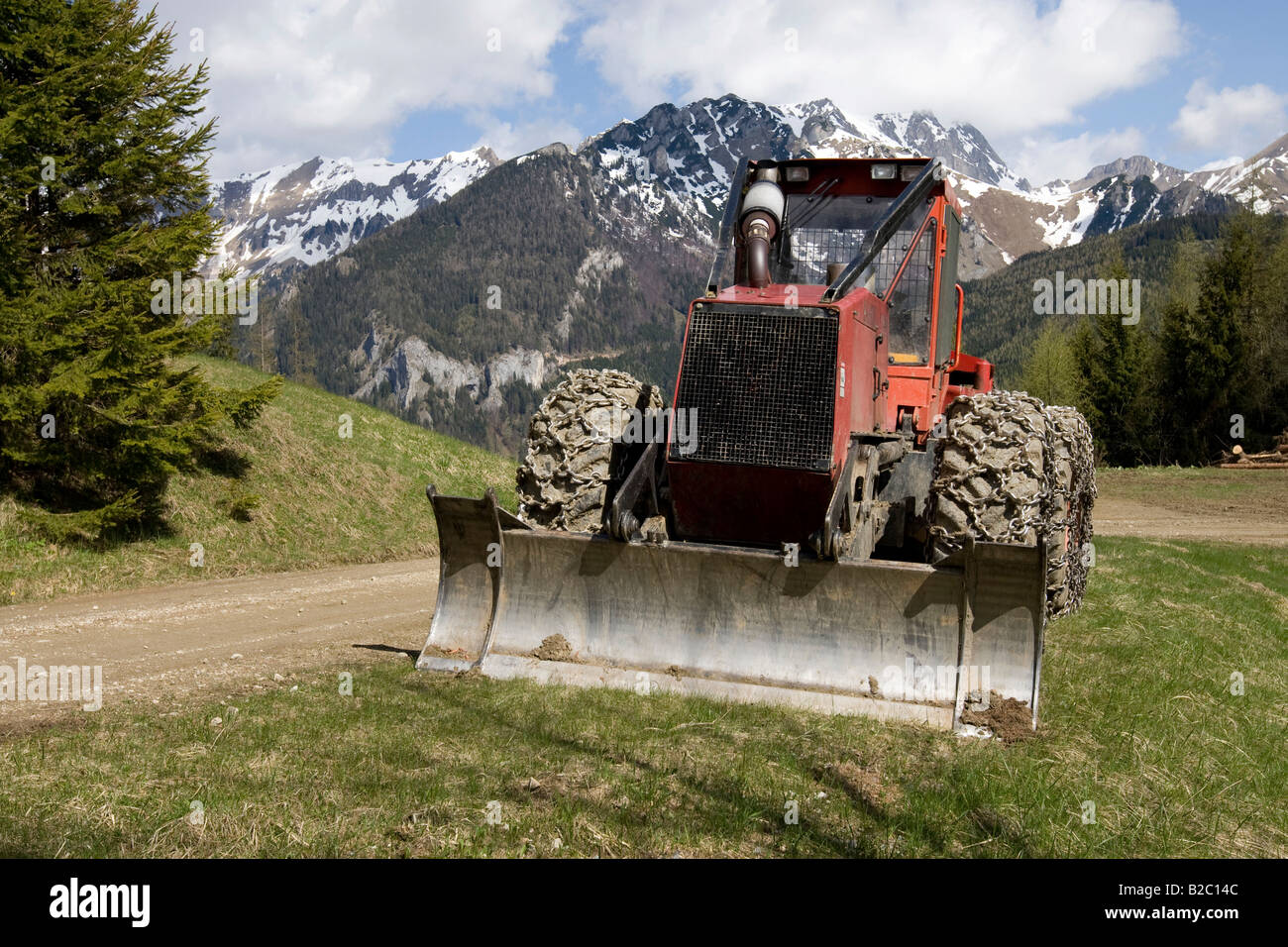 Heavy farm machine standing in a forest for removing trees after a ...