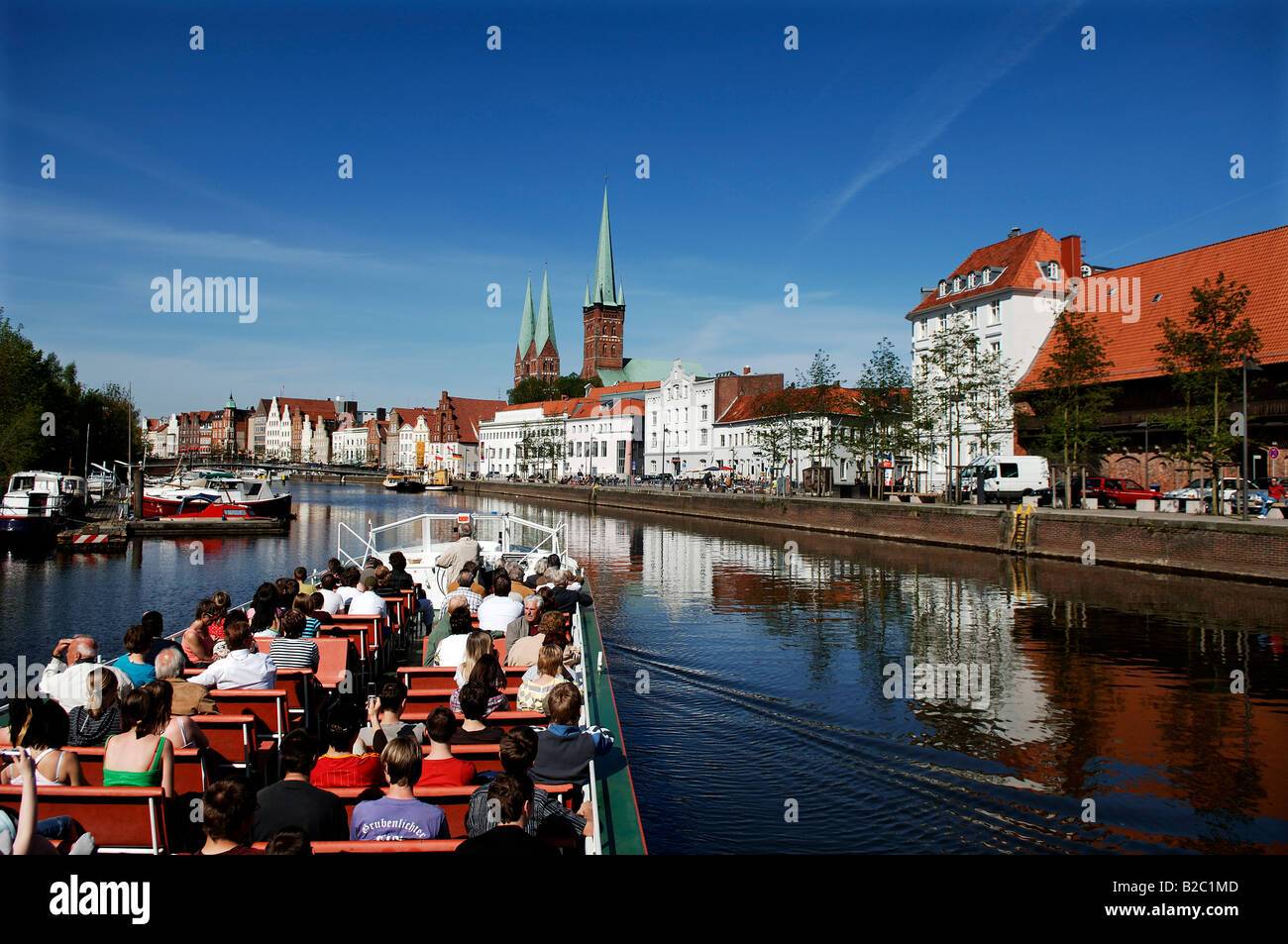 Harbour excursion around Luebeck, city and churches at back, Luebeck ...