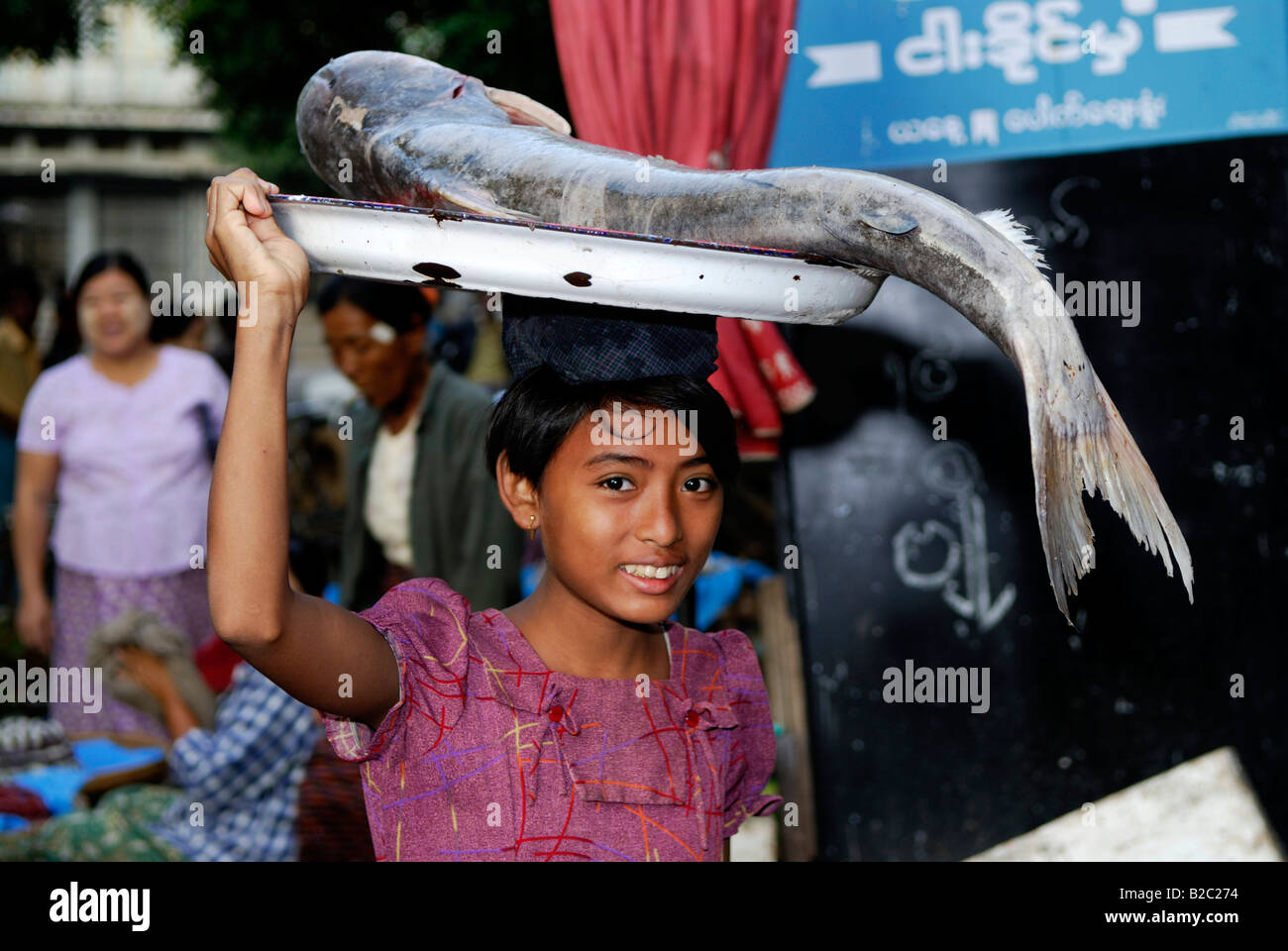 Girl carrying a fish on her head, Monywa, Myanmar, Southeast Asia Stock ...