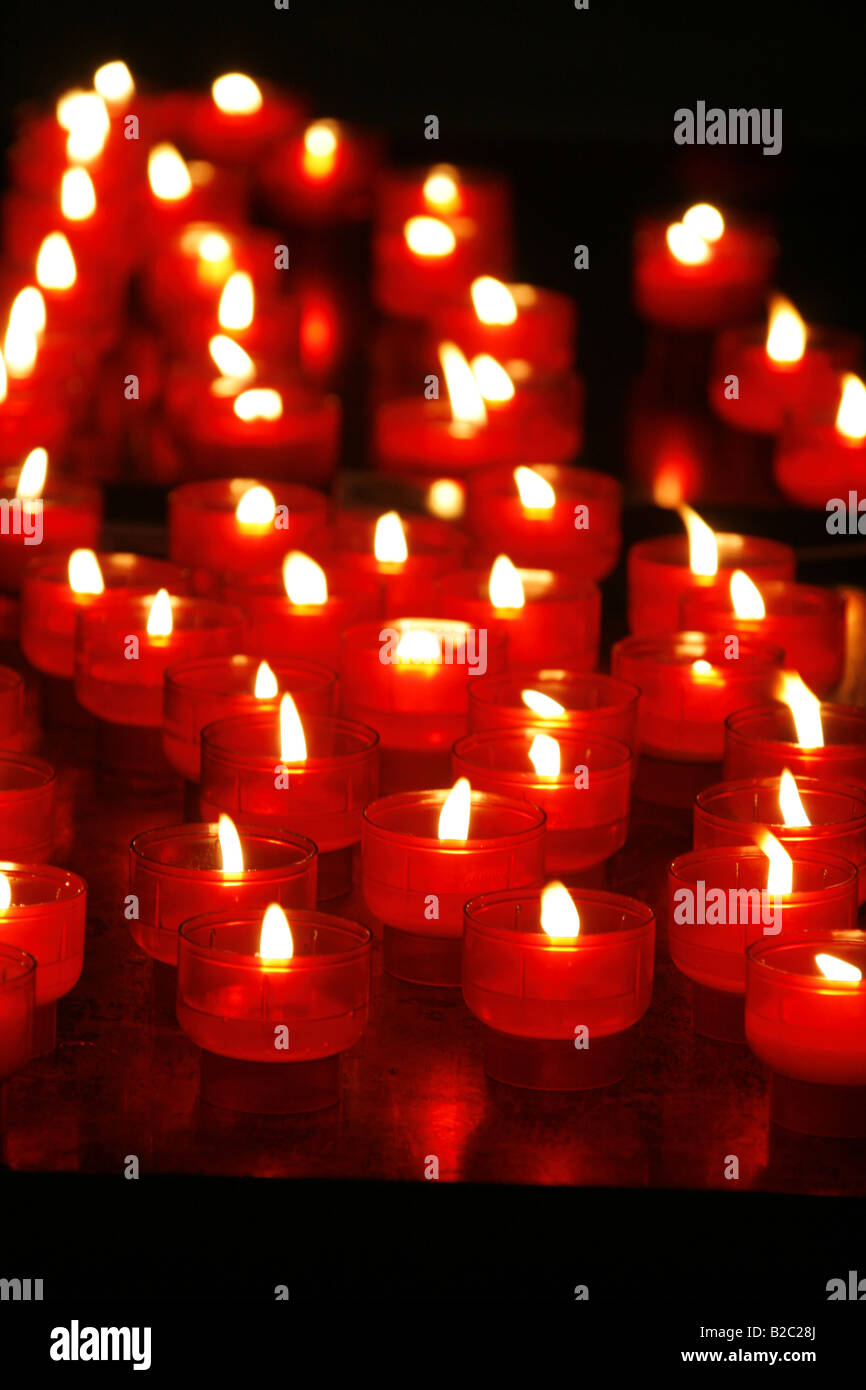 many lit candles in dark room in church Stock Photo - Alamy