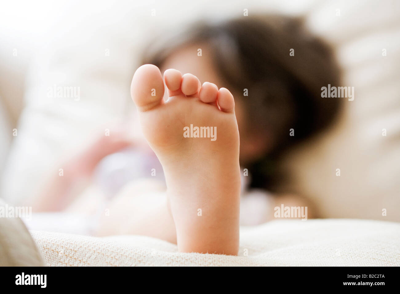 Close up of a girl child's left foot Stock Photo - Alamy