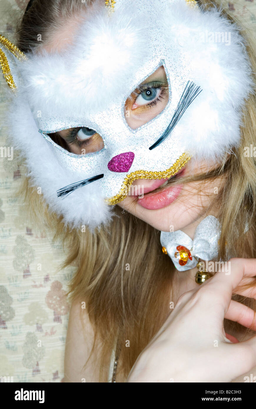 young woman wearing a cats mask Stock Photo - Alamy