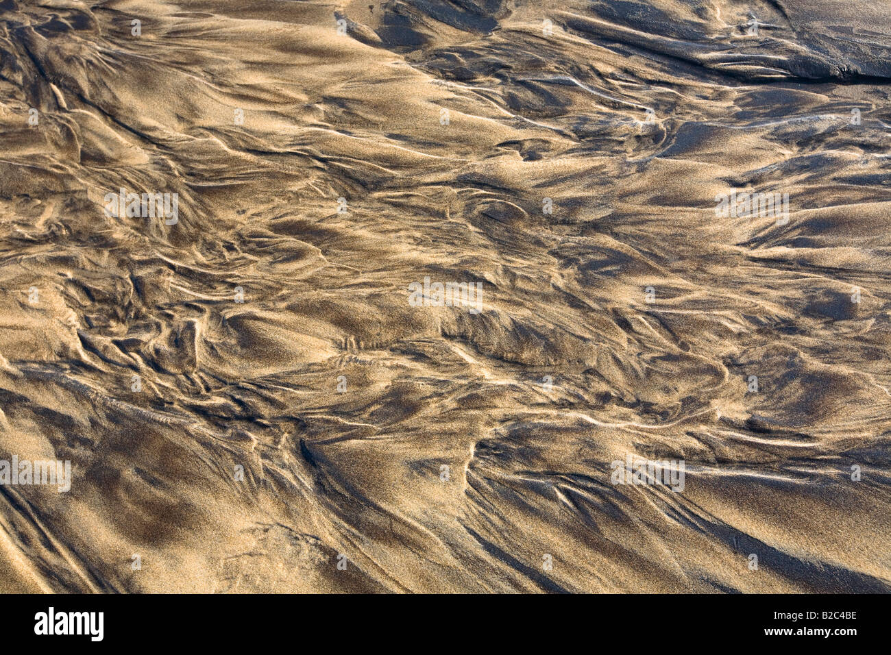 Patterns in the sand made by flowing water, beach, Atlantic Stock Photo ...