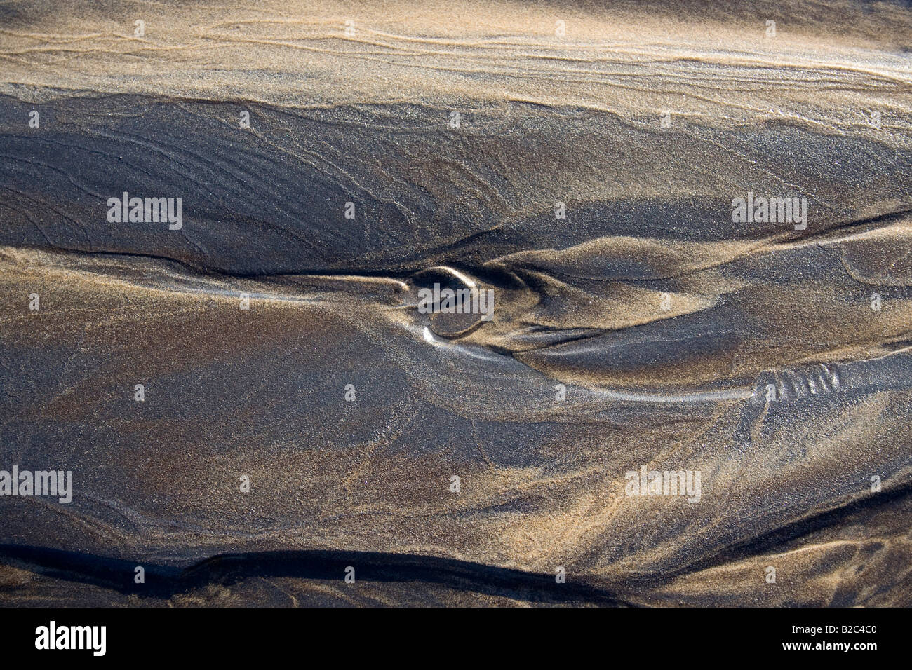 Patterns in the sand from flowing water, beach, Atlantic Stock Photo ...