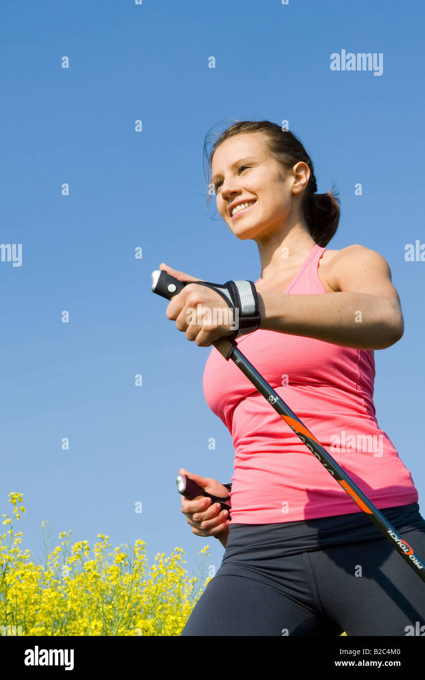 young woman nordic walking Stock Photo - Alamy young woman nordic walking Stock Photo - Alamy