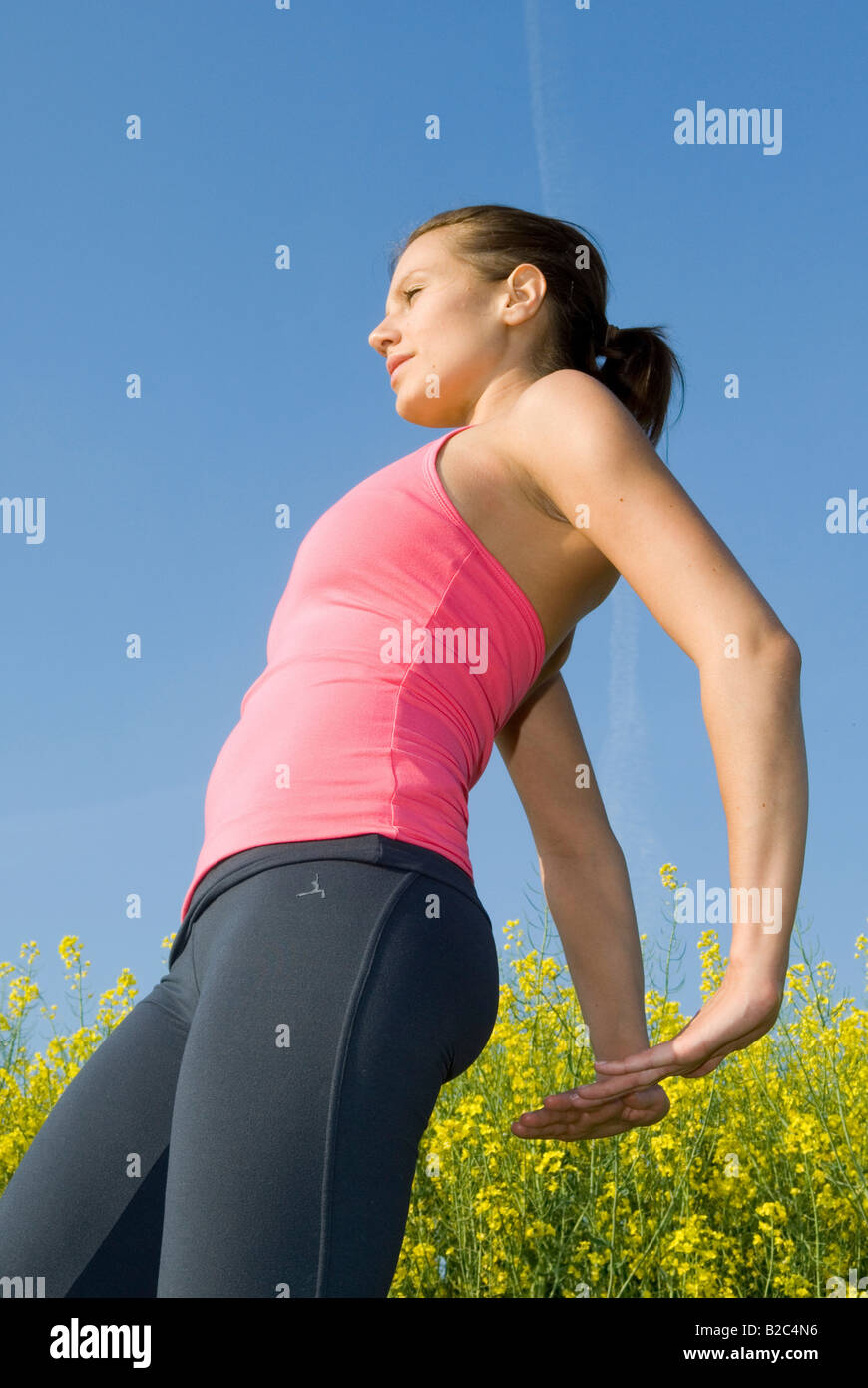 young woman stretching her inner calves musculature Stock Photo - Alamy