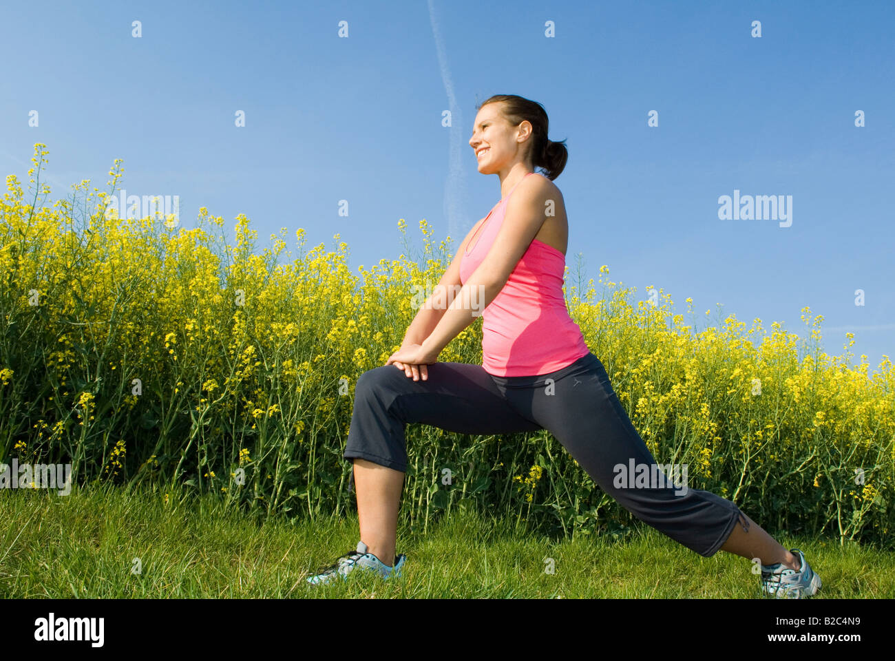 young woman stretching her outer calves musculature Stock Photo - Alamy