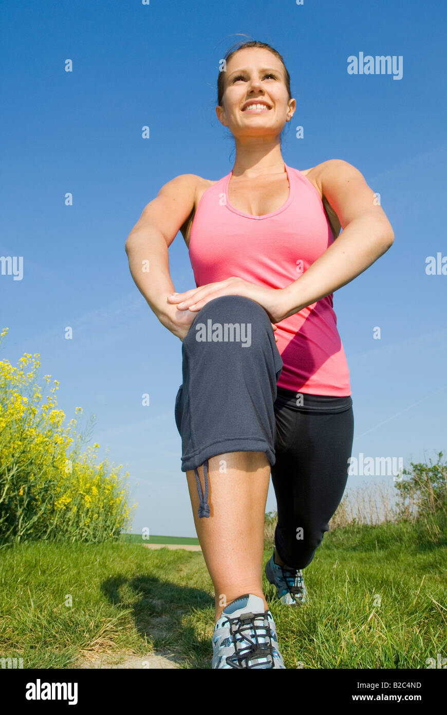 young woman stretching her outer calves musculature Stock Photo - Alamy
