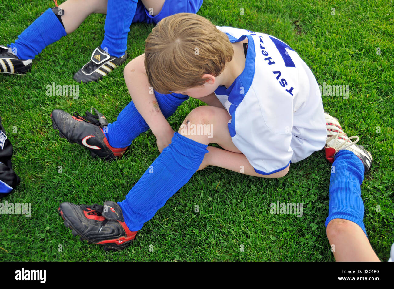 Disappointed 8 year old child after loosing hi-res stock photography ...