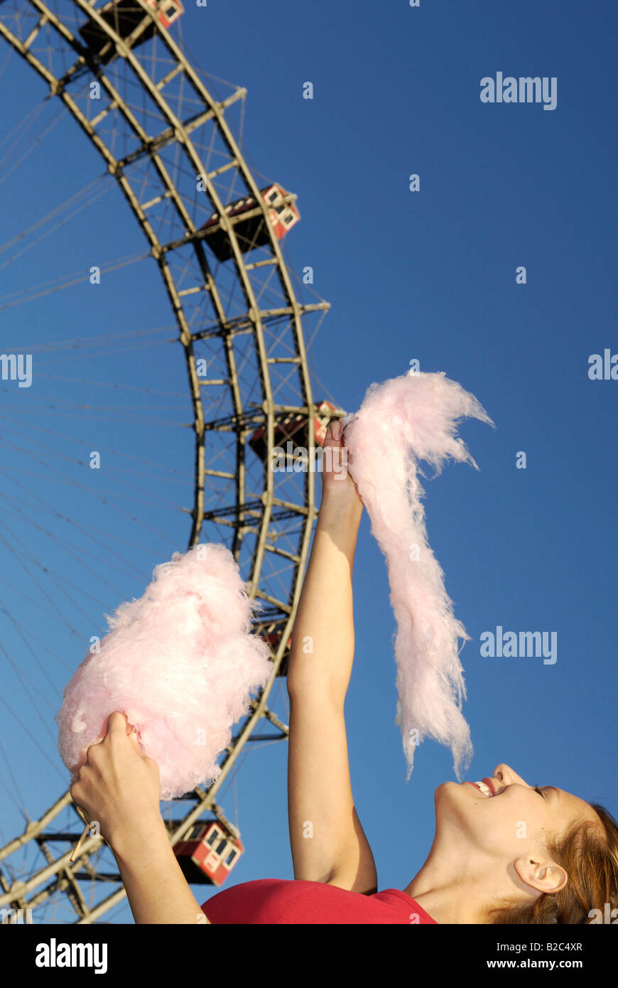 amusement park Prater Vienna, young woman with candy floss, Giant Ferry ...