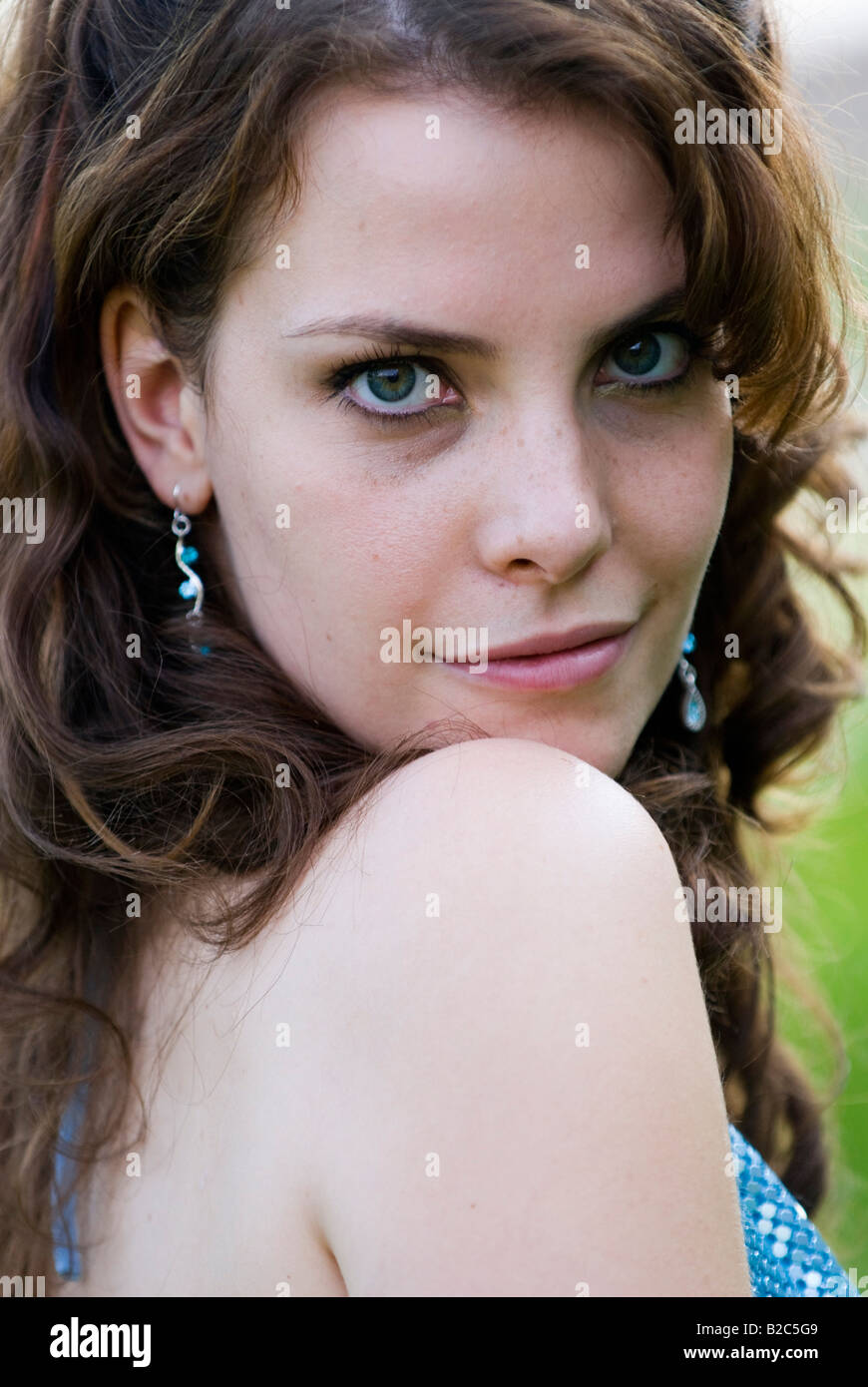 portrait of a young woman looking over her shoulder Stock Photo - Alamy