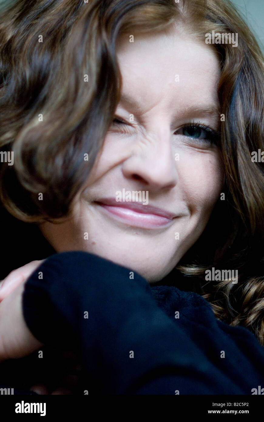 Portrait young woman, winking Stock Photo - Alamy