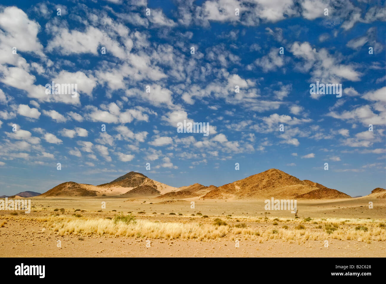 Clouds in sky above Tiras Mountains, Namibrand, Namib Desert, Namibia ...