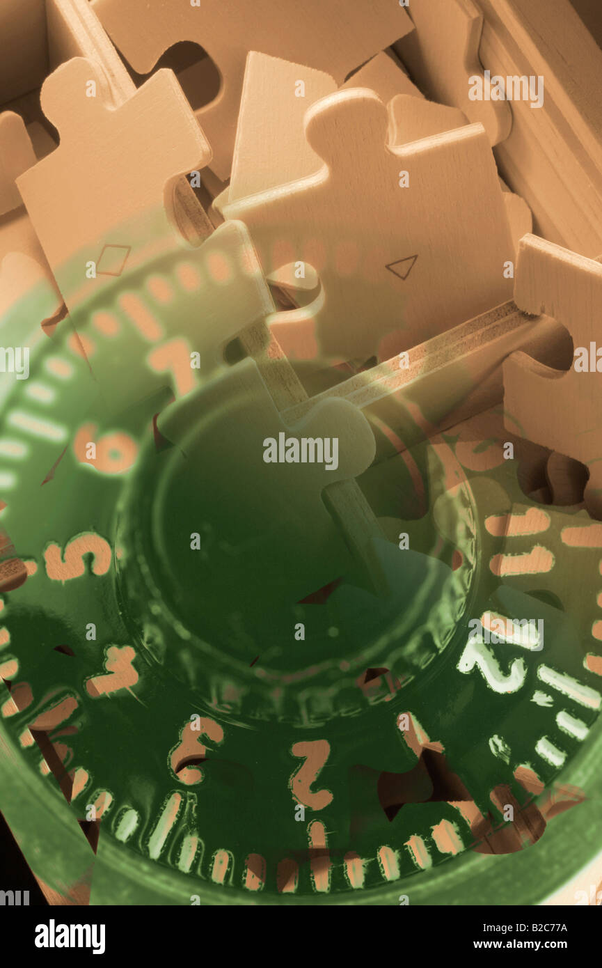 Composite of puzzle pieces and combination lock Stock Photo - Alamy