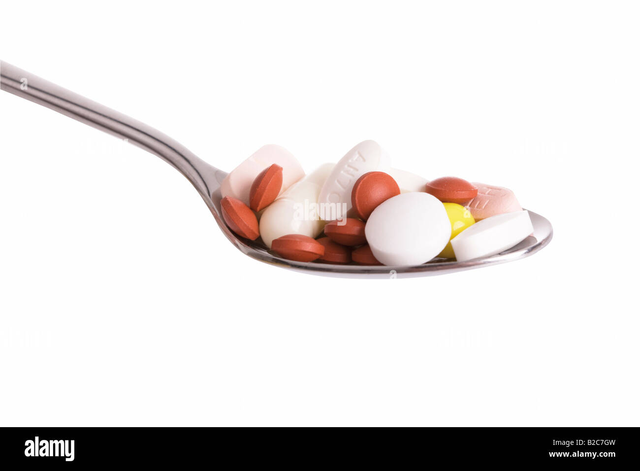 Tablets on a spoon Stock Photo - Alamy