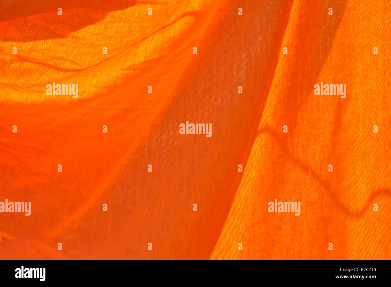 Orange fabric, cloth with creases Stock Photo - Alamy