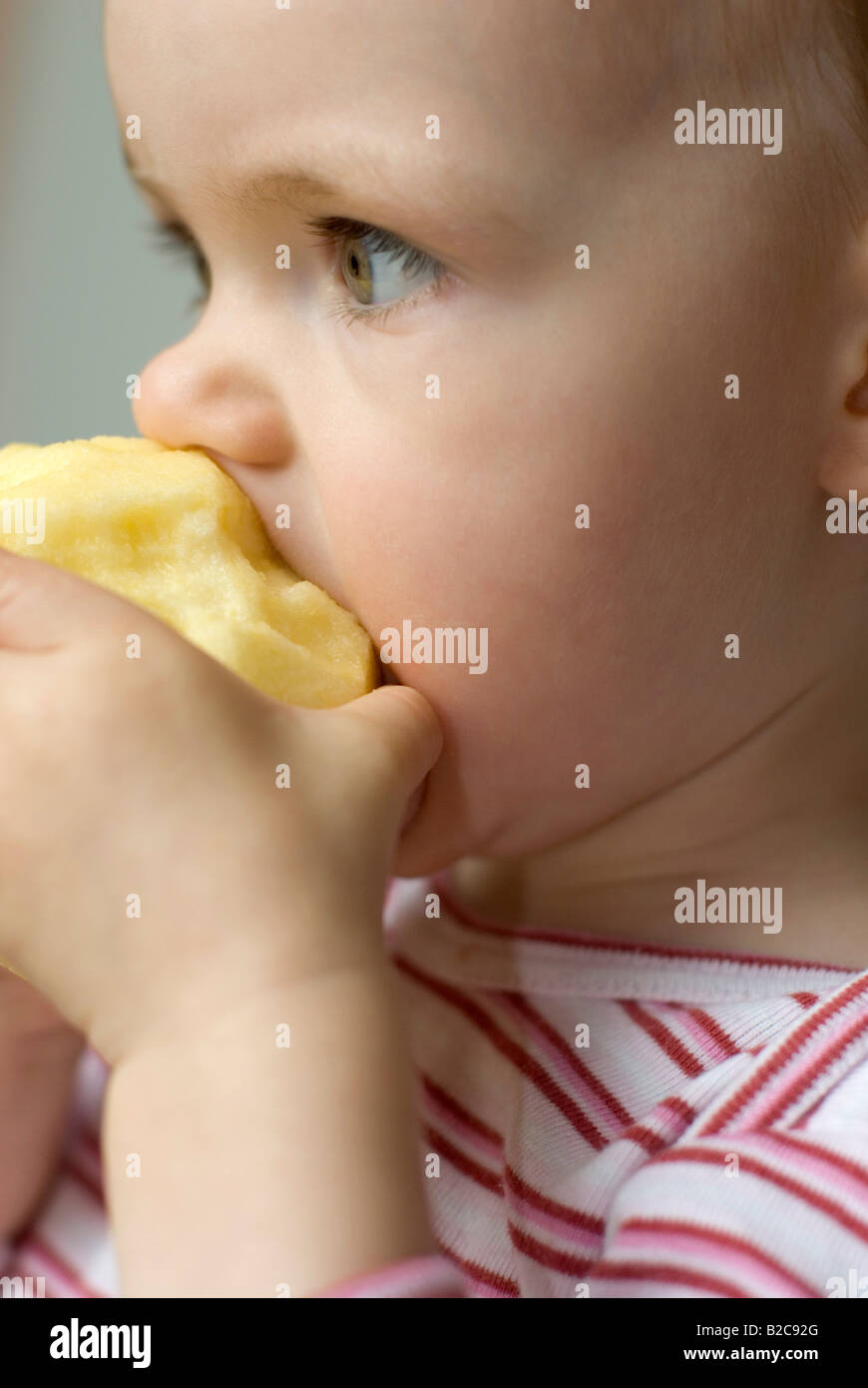 Little Child Eating Fruit Stock Photo - Alamy