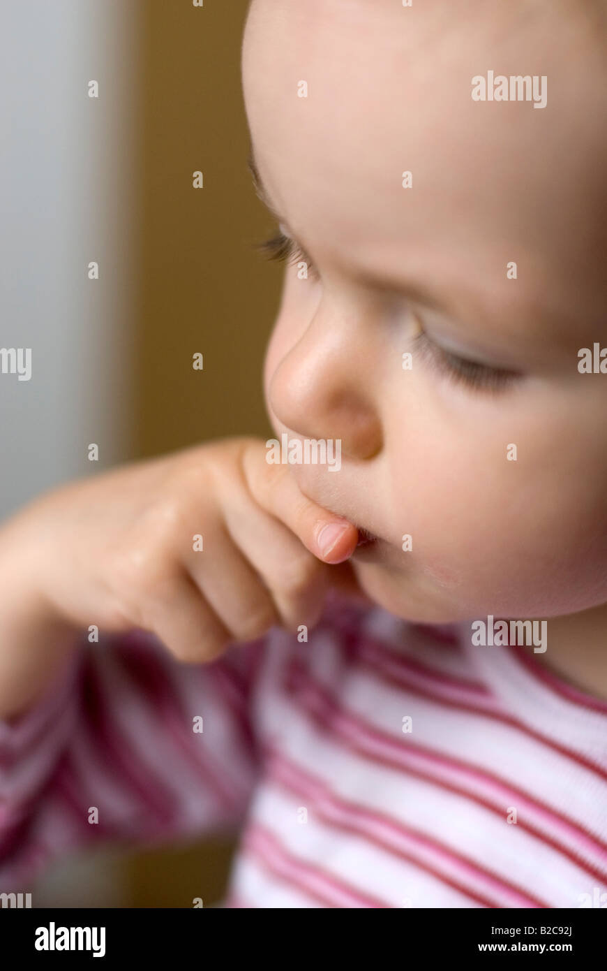Little Child in a Thoughtful Pose Stock Photo - Alamy