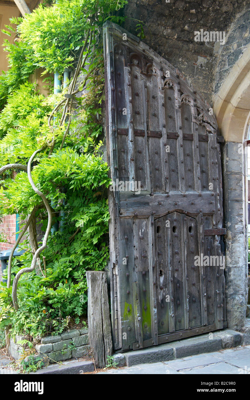 Ancient timber gate into Winchester Cathedral close near Kings gate ...