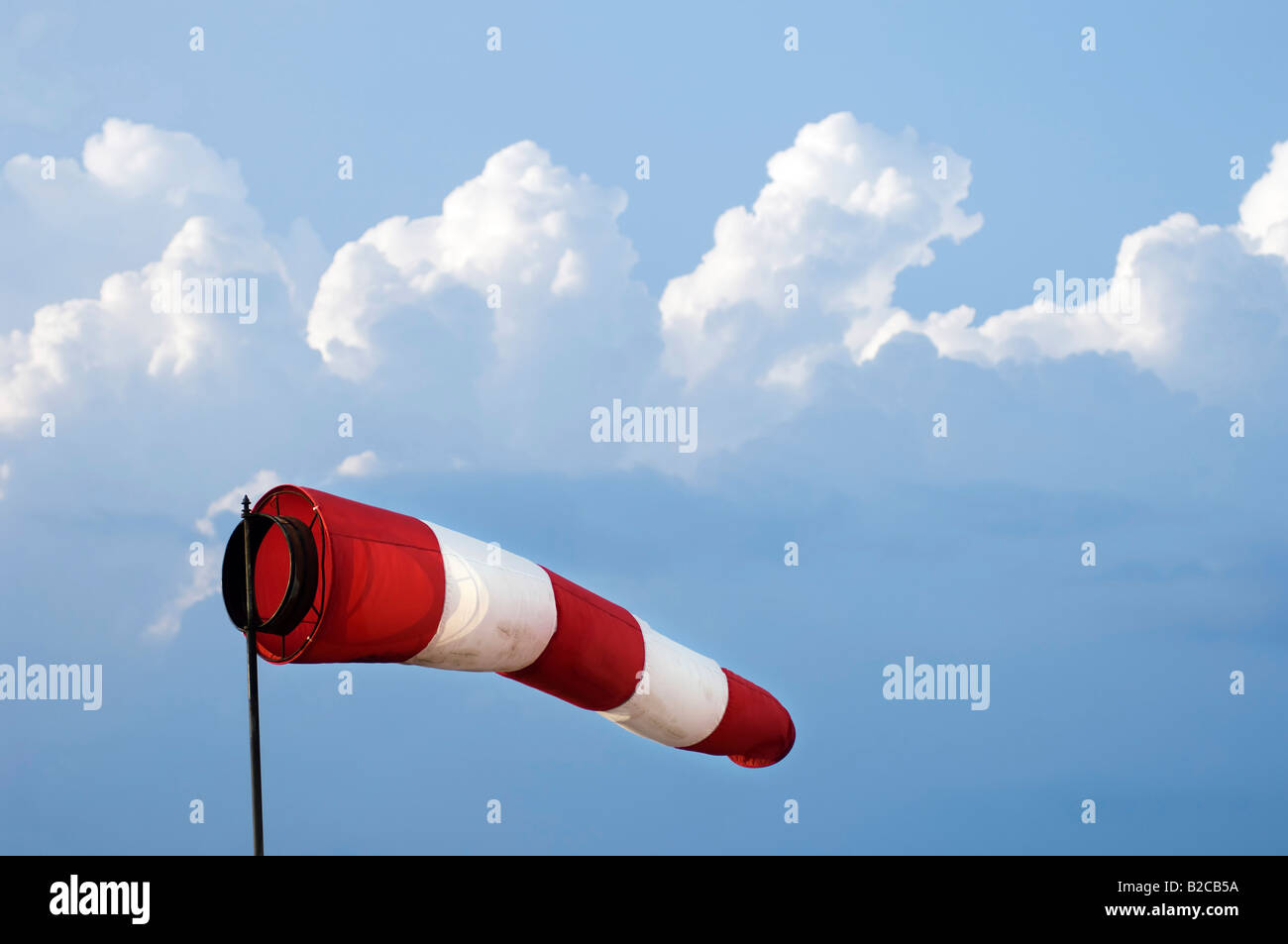 Windsock close up against the blue sky with clouds Stock Photo - Alamy