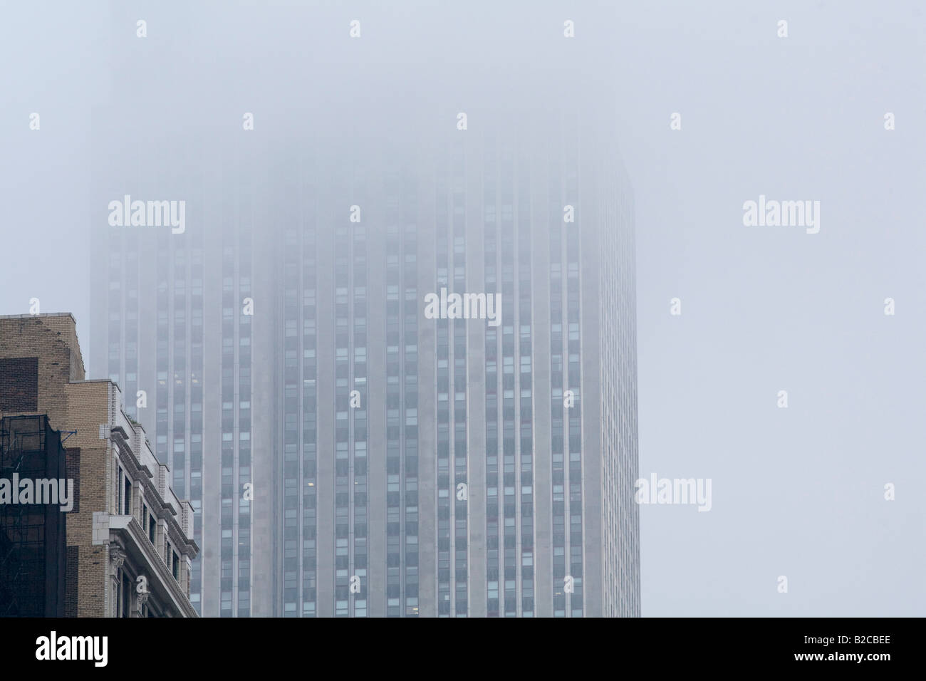 Empire State Building in fog, NYC Stock Photo - Alamy