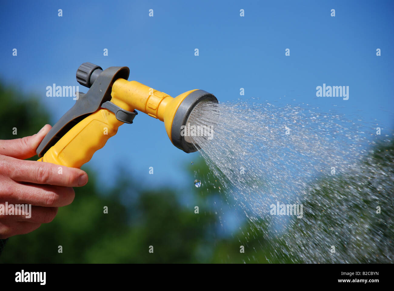 Hand hose sprinkle watering hi-res stock photography and images - Alamy