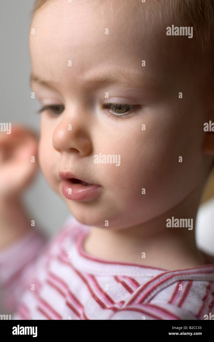 Little Child Looking Downwards Stock Photo - Alamy