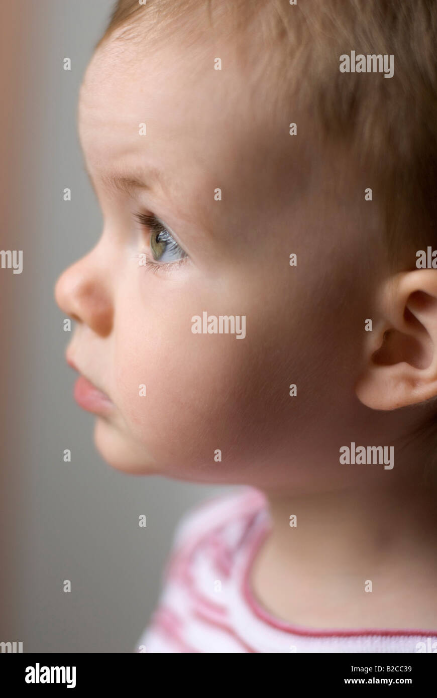 Little Girl Looking Away into Distance Stock Photo - Alamy