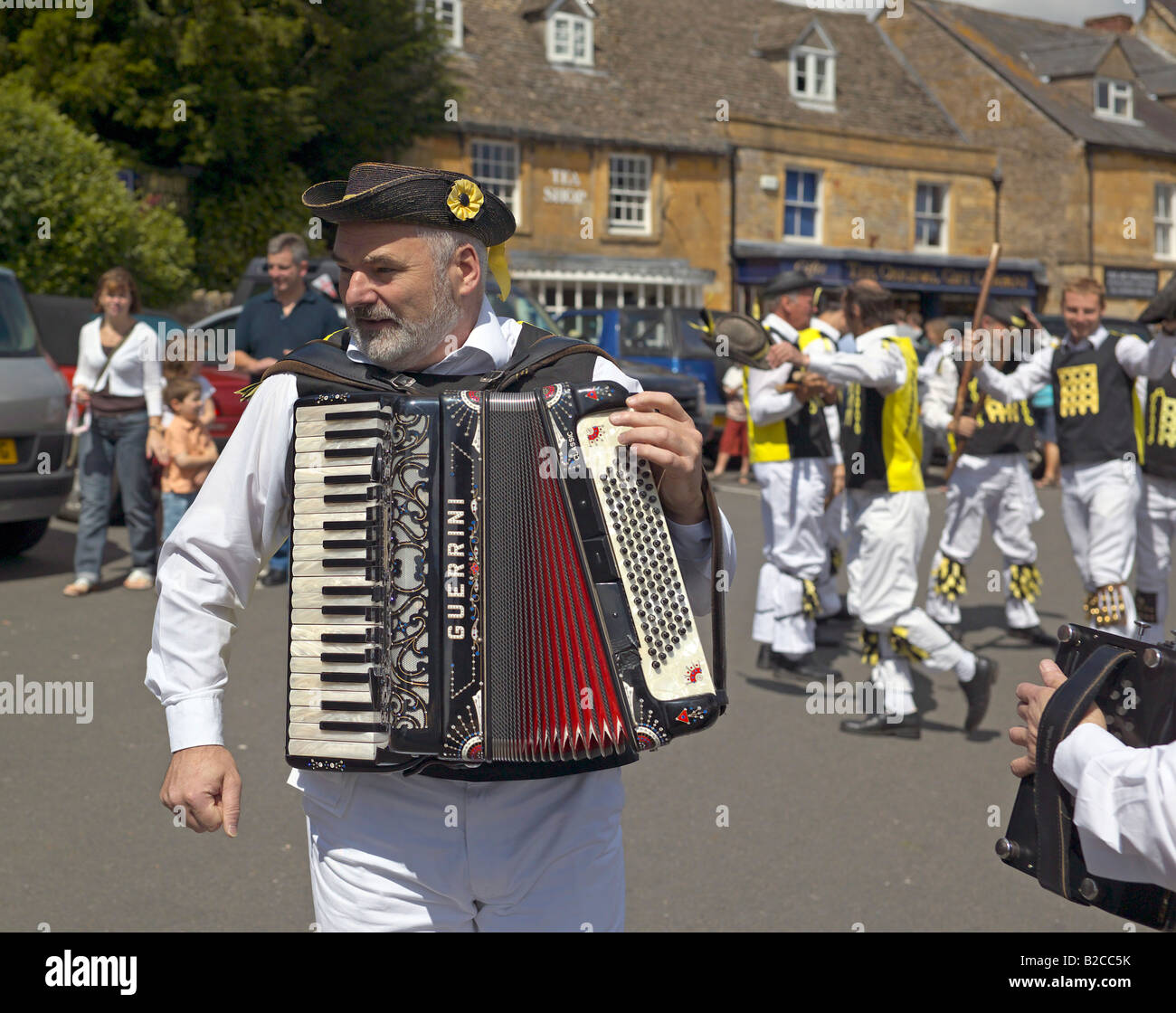 Accordion musician and morris dancers playing and dancing in Stow-on ...