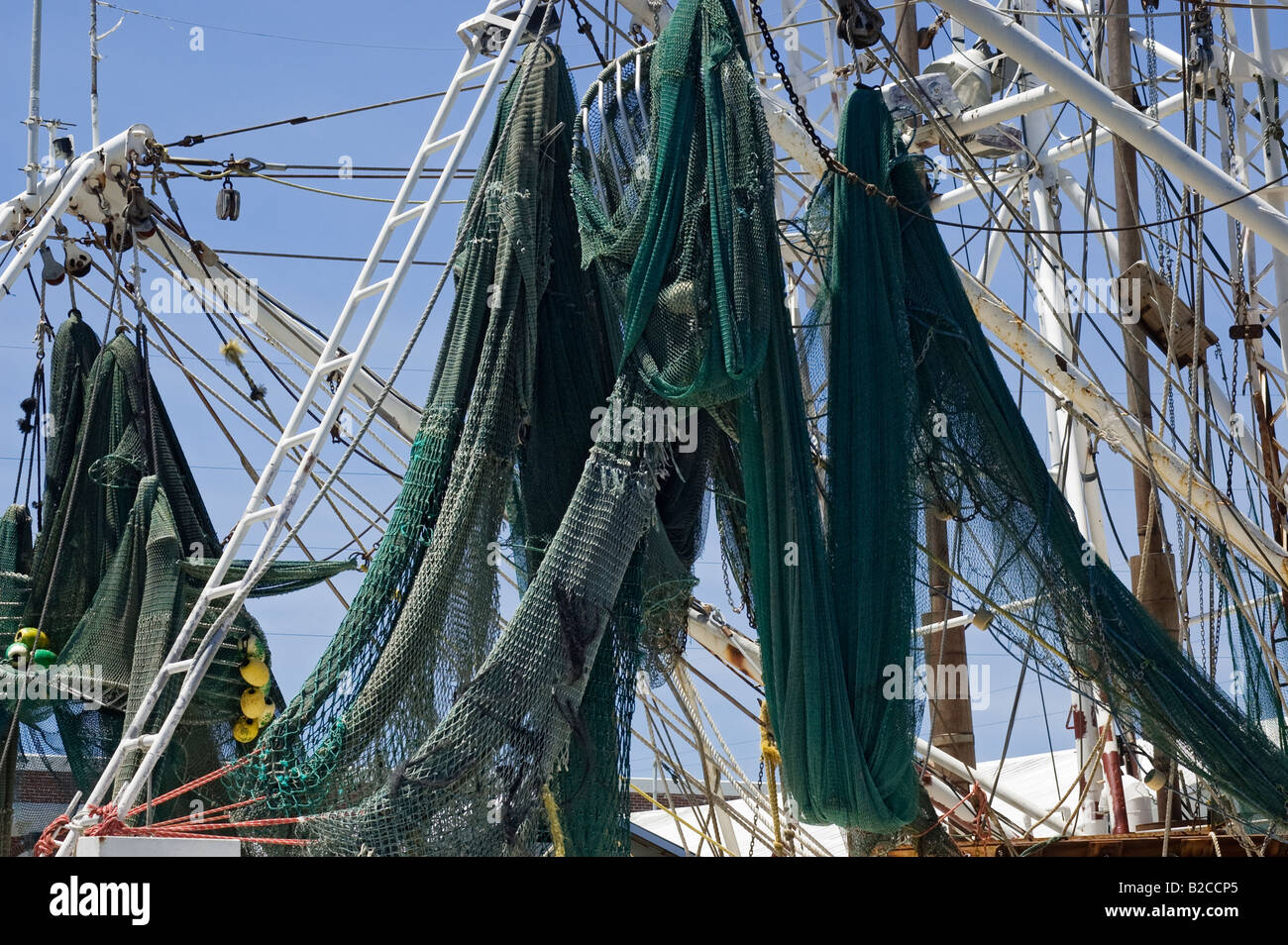 shrimp trawlers net system Apalachicola Florida Stock Photo - Alamy