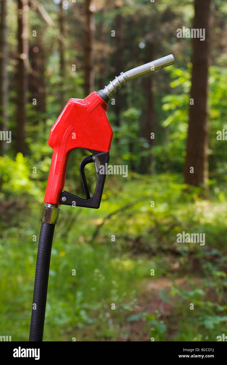 Gas pump nozzle in a forest Stock Photo - Alamy