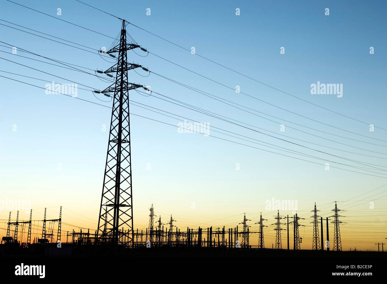 Power substation and pylon with distribution lines at sunset Stock ...