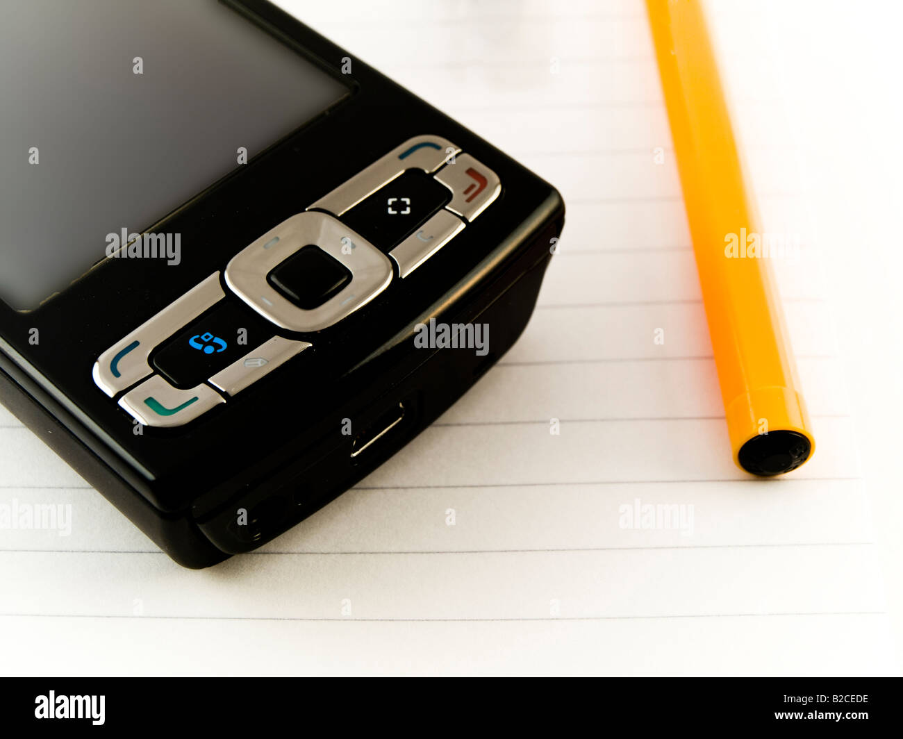 Ballpoint Pen and Mobile Phone on Notepad White Background Stock Photo ...