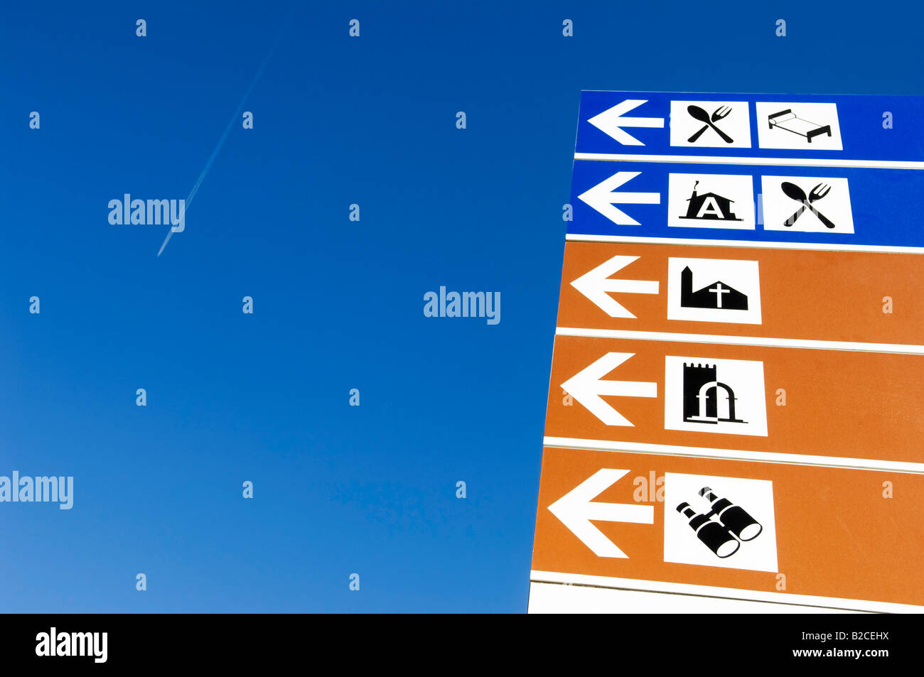 A picture of some blue and white directional signs with icons printed ...