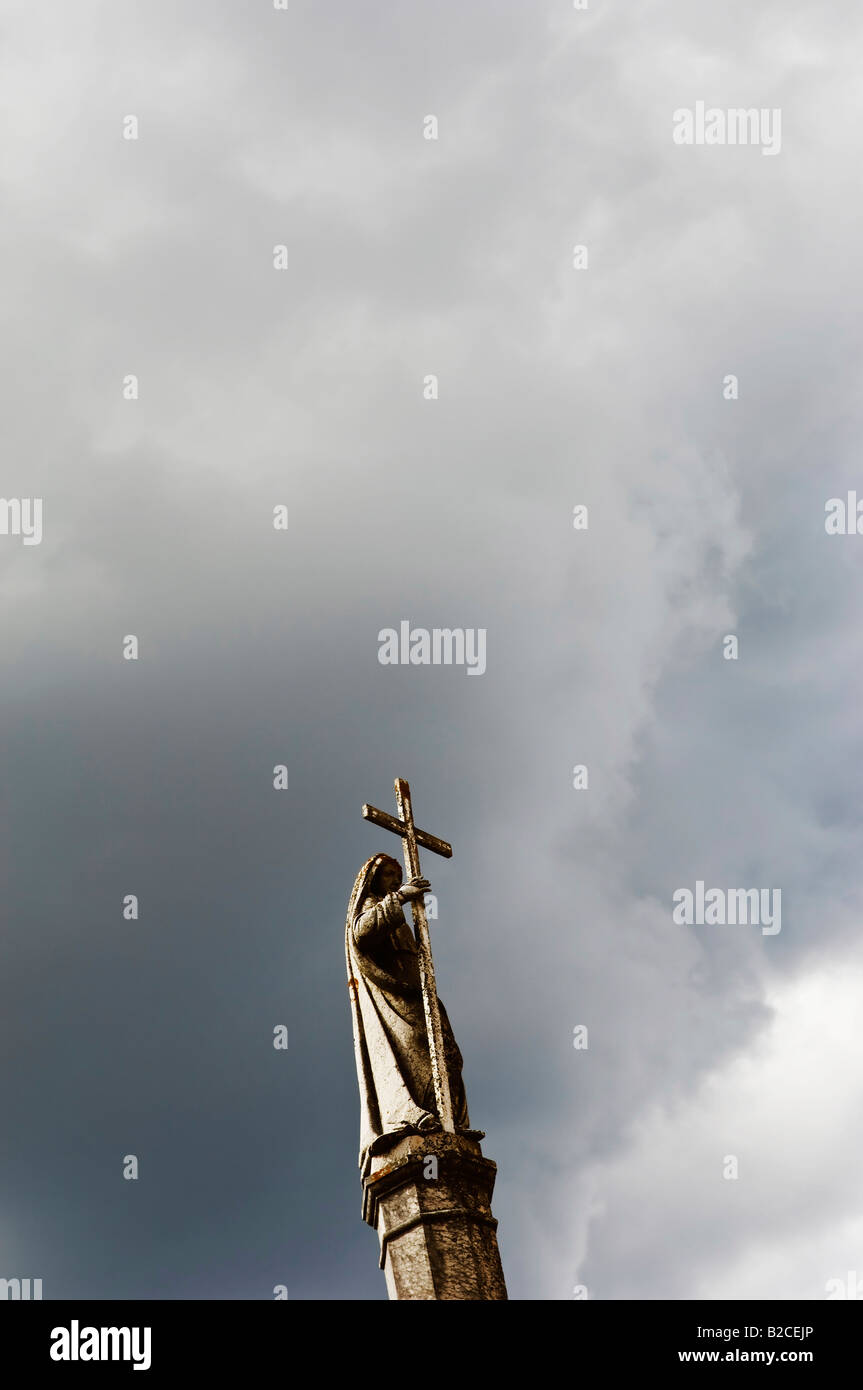 Saint holding a cross hi-res stock photography and images - Alamy