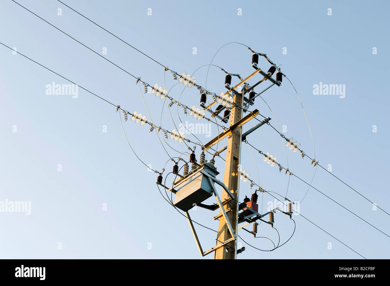 Electricity pole and wiring against the blue sky Stock Photo - Alamy